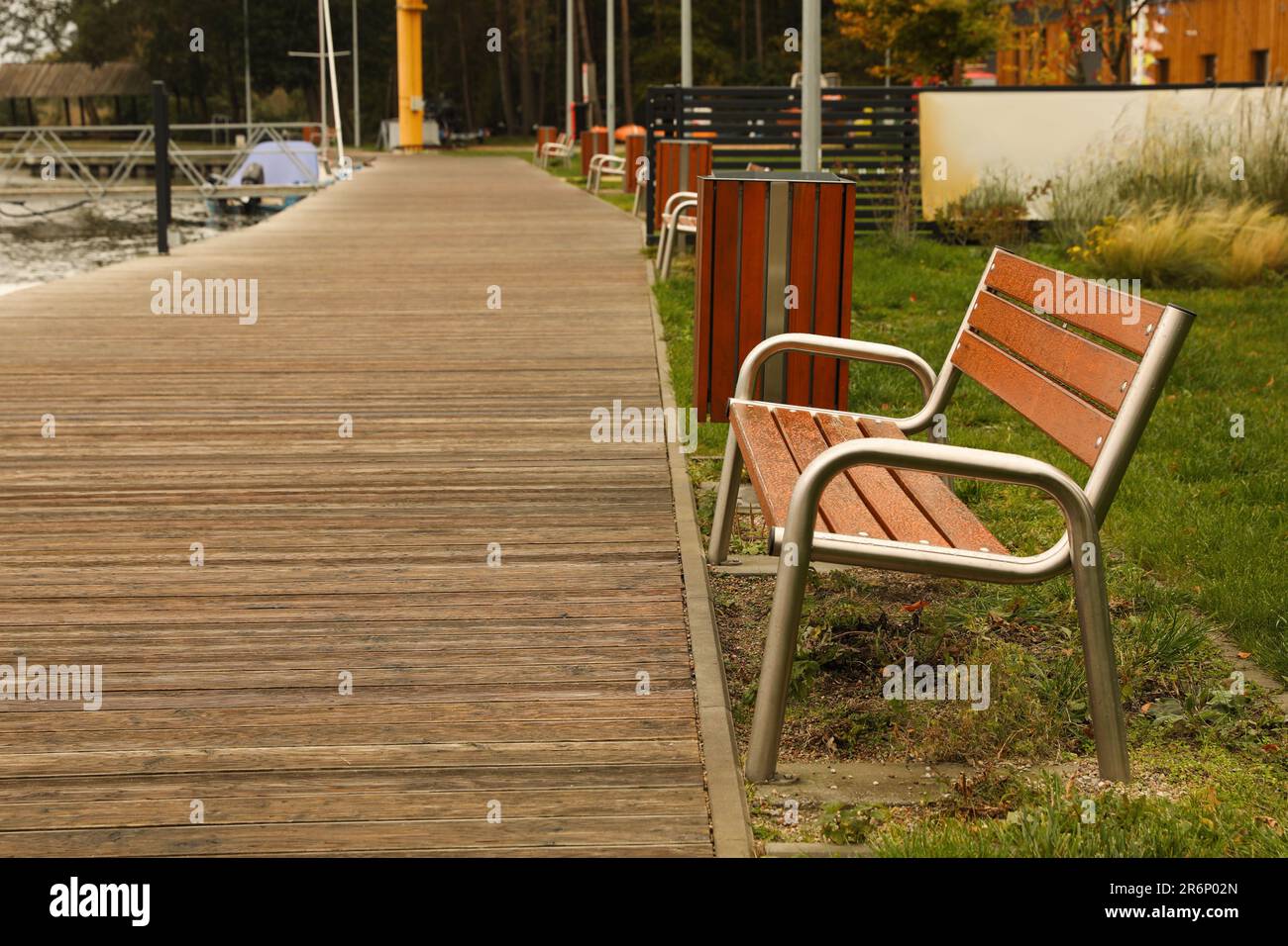 Wooden benches near pathway outdoors. Real estate Stock Photo - Alamy