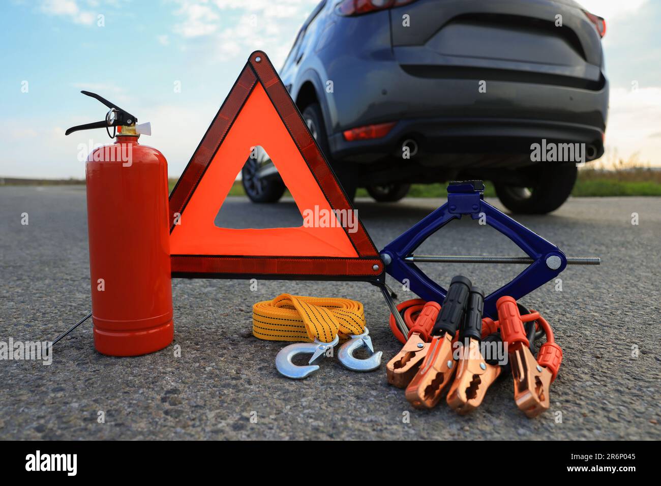 Emergency warning triangle and car safety equipment outdoors Stock ...
