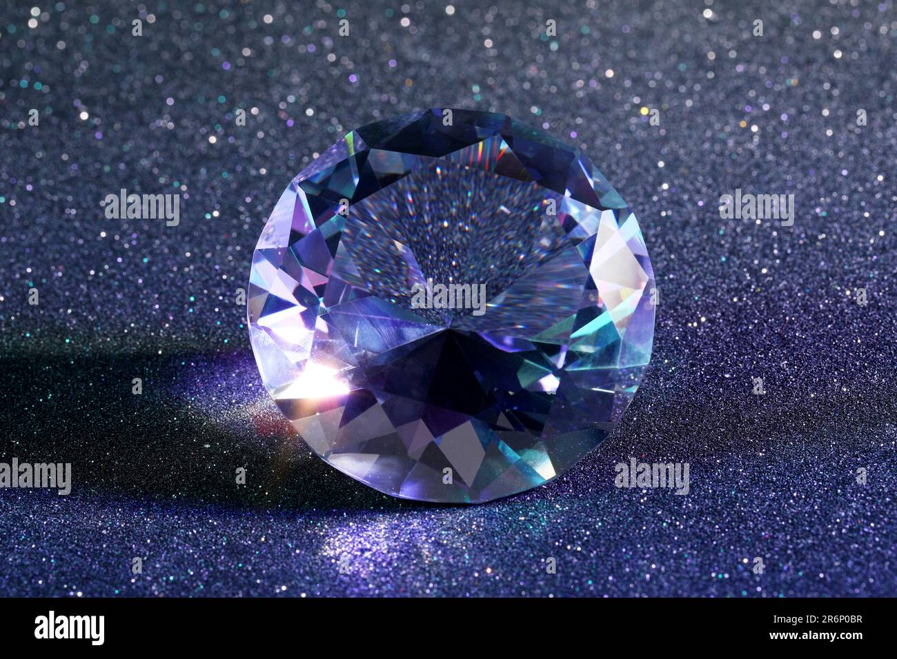 Beautiful dazzling diamond on glitter background, closeup Stock Photo ...