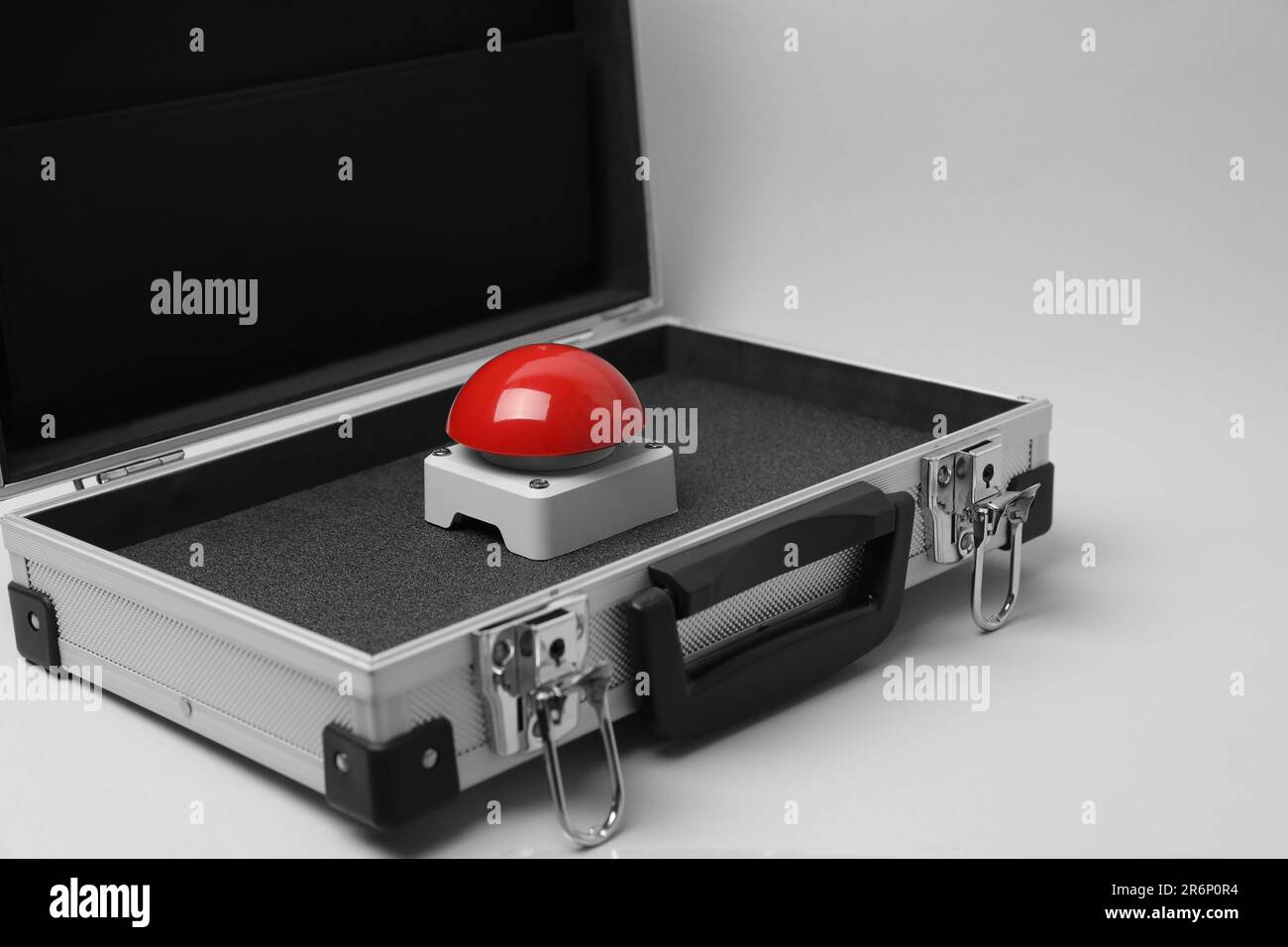 Red button of nuclear weapon in suitcase on white background. War ...