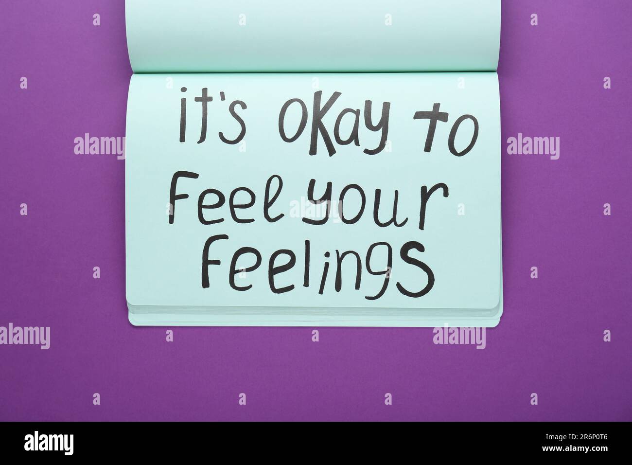 Notebook with phrase It`s Okay To Feel Your Feelings on purple ...