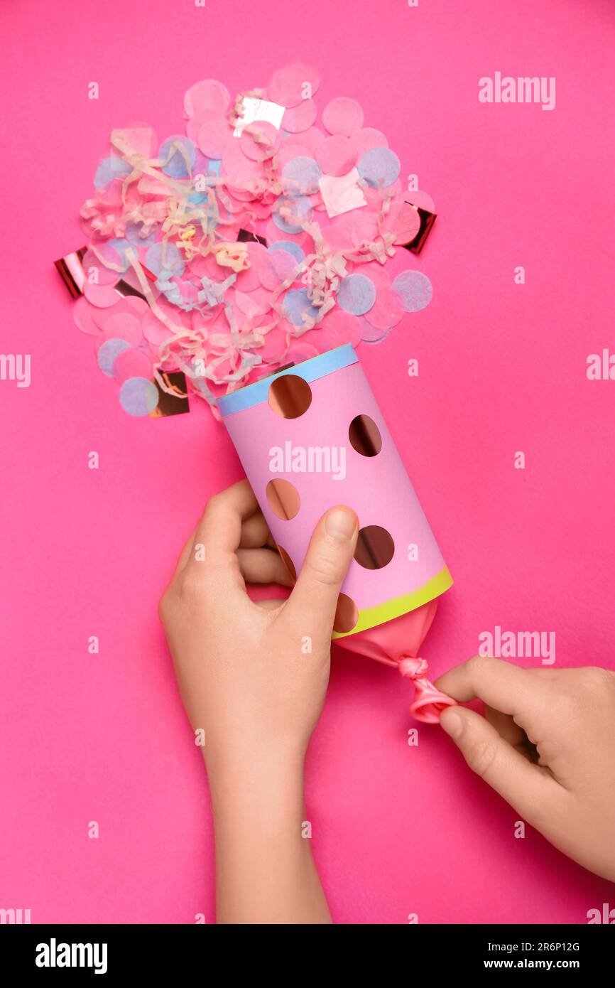 Woman with party popper hi-res stock photography and images - Alamy