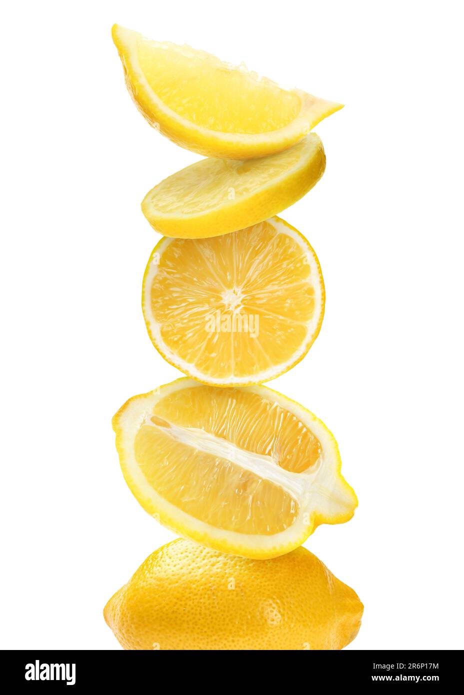 Stacked cut and whole lemons on white background Stock Photo - Alamy