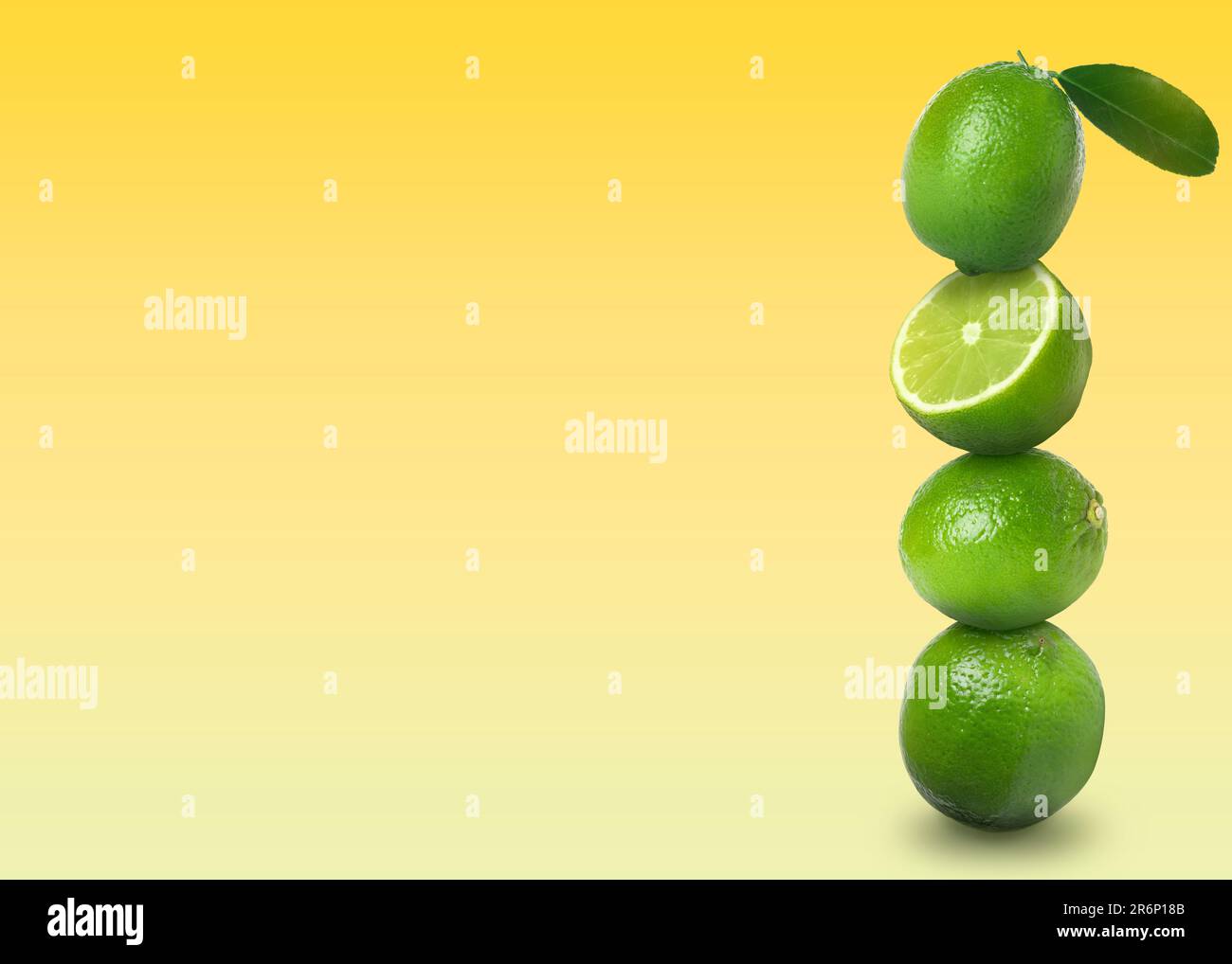Stacked whole and cut limes on yellow background, space for text Stock ...
