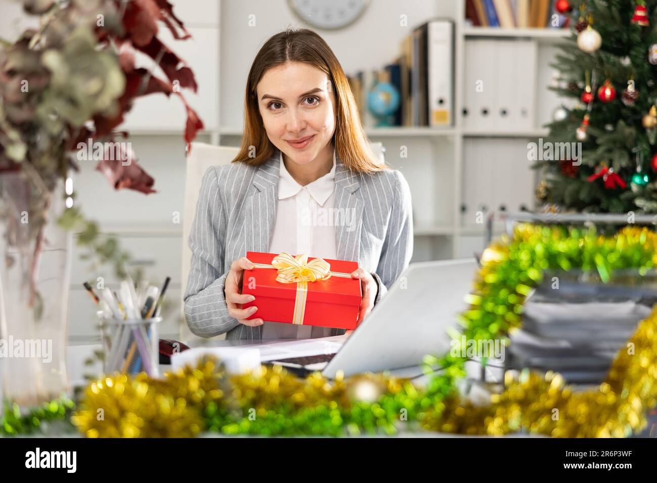 Woman receiving present in box before Christmas Stock Photo - Alamy