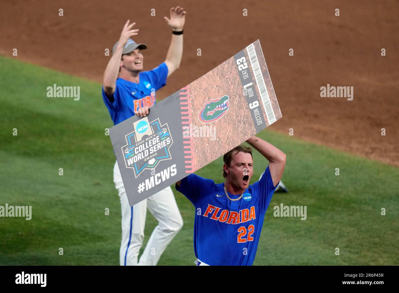 Florida pitcher Brandon Neely (22) celebrates with a poster size ticket ...