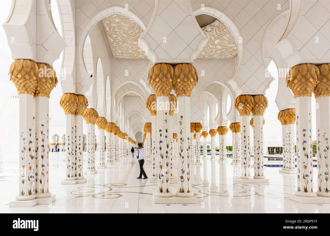 People walk among the pillars and arches in the Sheikh Zayed Grand ...