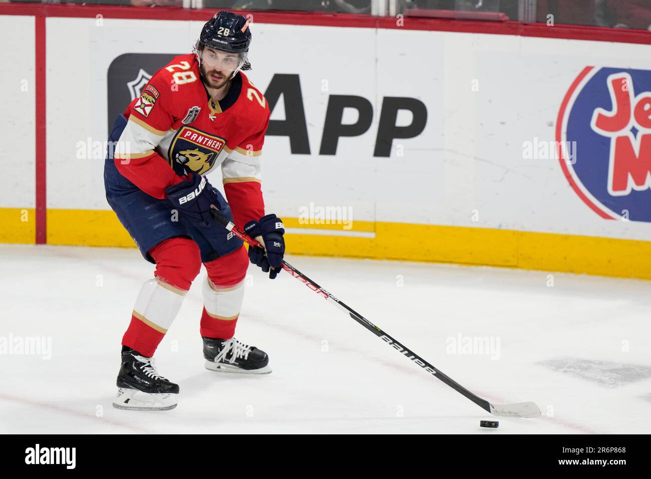 Florida Panthers defenseman Josh Mahura (28) looks to pass the puck ...