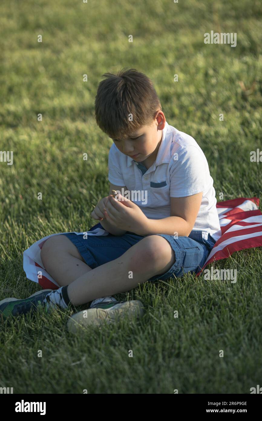 Kid boy celebrating of July, 4 Independence Day of USA . Child running ...