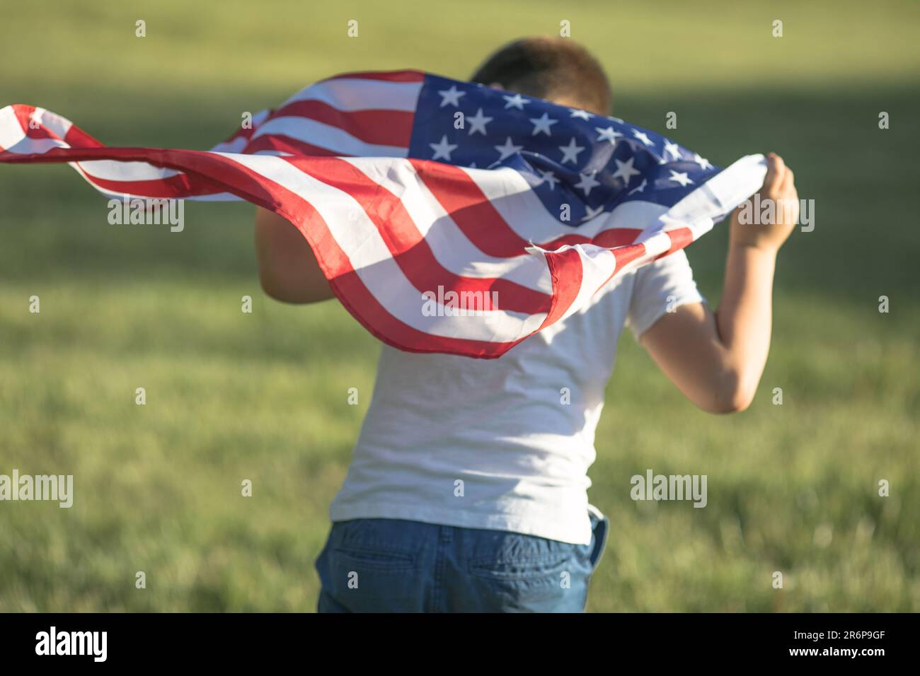 Kid boy celebrating of July, 4 Independence Day of USA . Child running ...