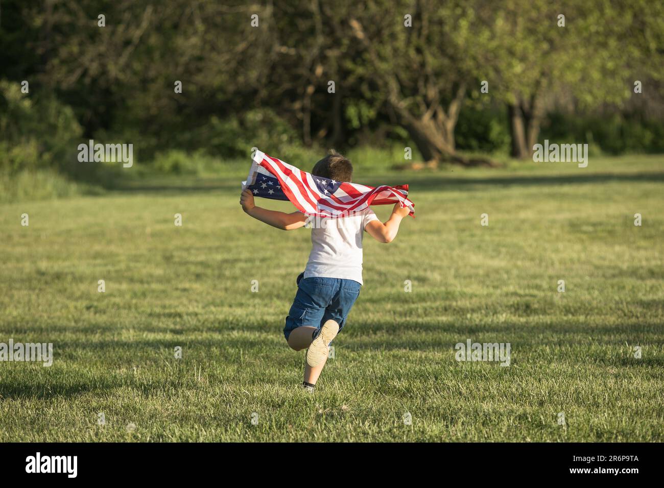 Kid boy celebrating of July, 4 Independence Day of USA . Child running ...