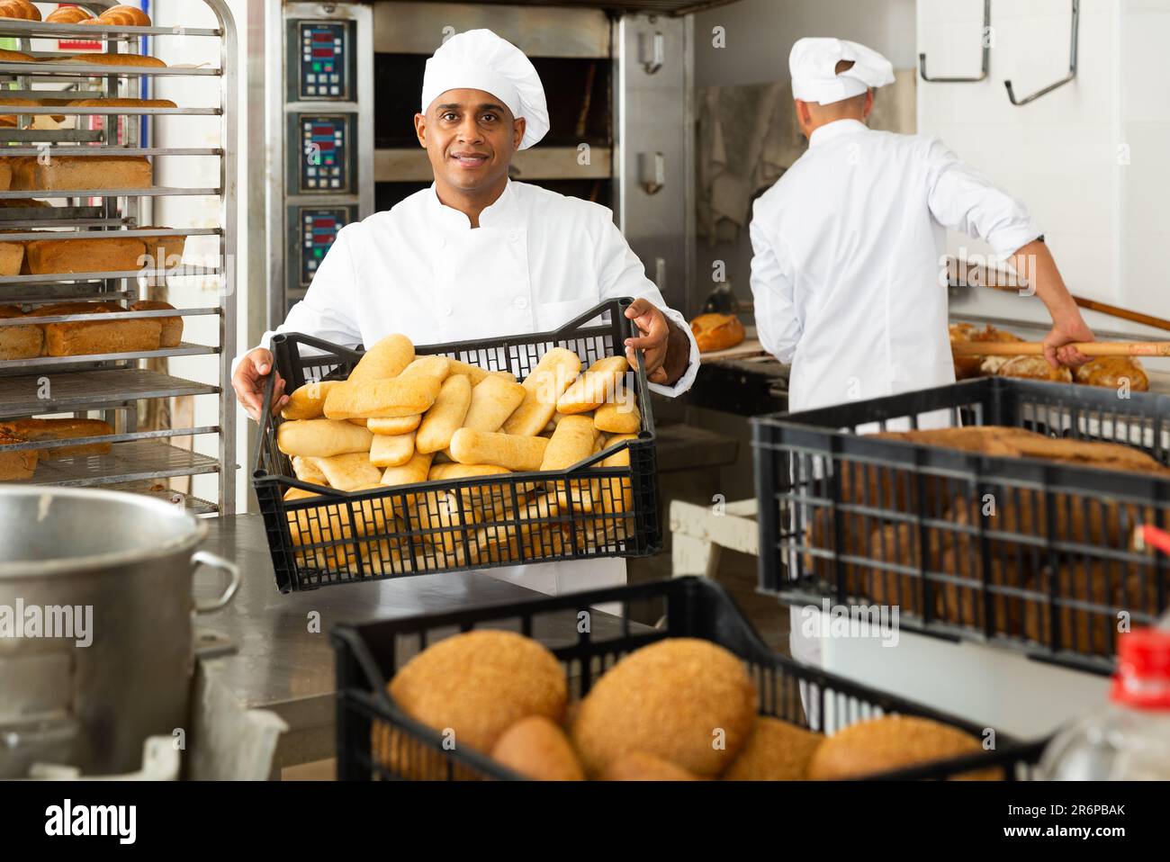 Portrait of successful baker during daily work Stock Photo - Alamy