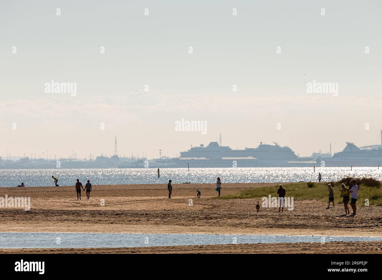 People enjoying a walk on the beach despite recent beach closures due ...