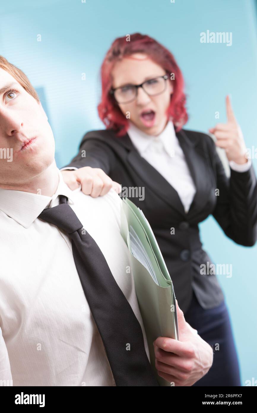 Workplace mistreatment: A woman mistreating a man, expressing ...