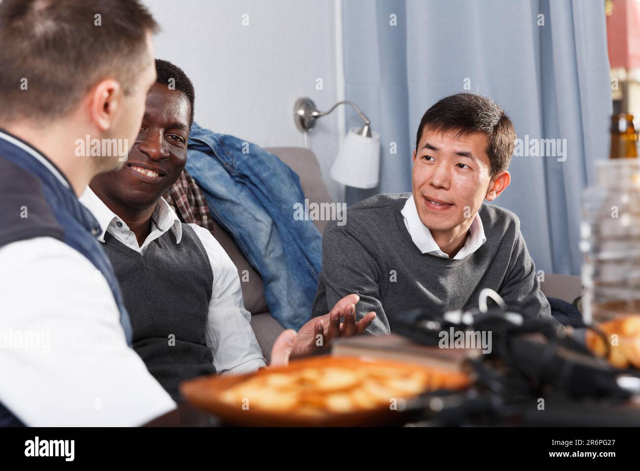 Three men are drinking beer and talking about life in time rest ...