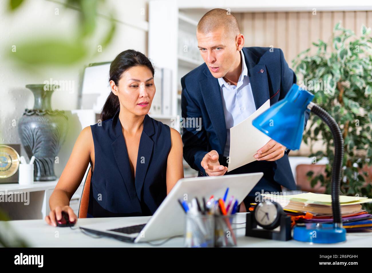 Business people working with papers together Stock Photo - Alamy
