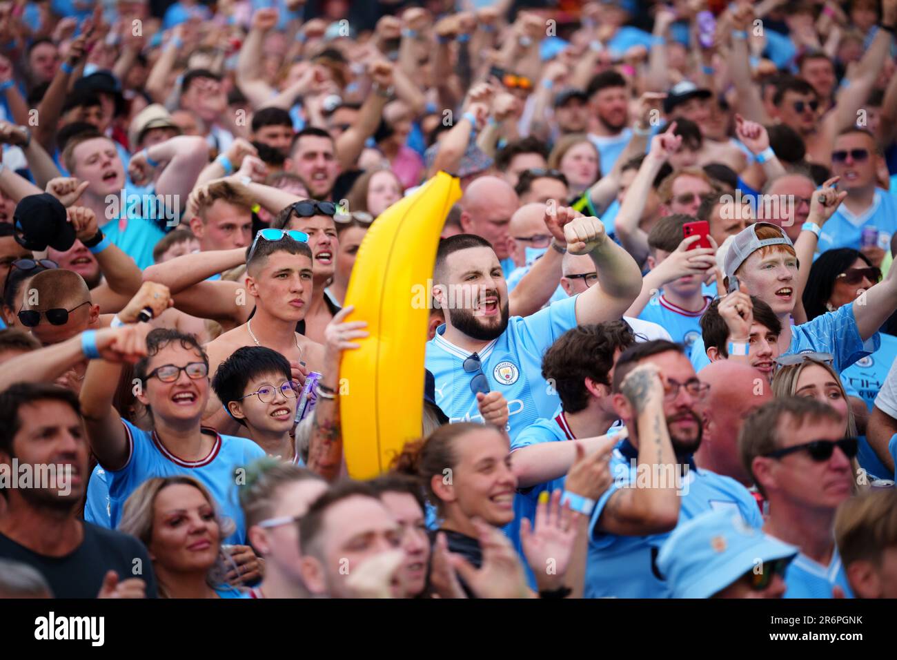 Manchester, Britain. 10th June, 2023. Manchester City supporters watch ...