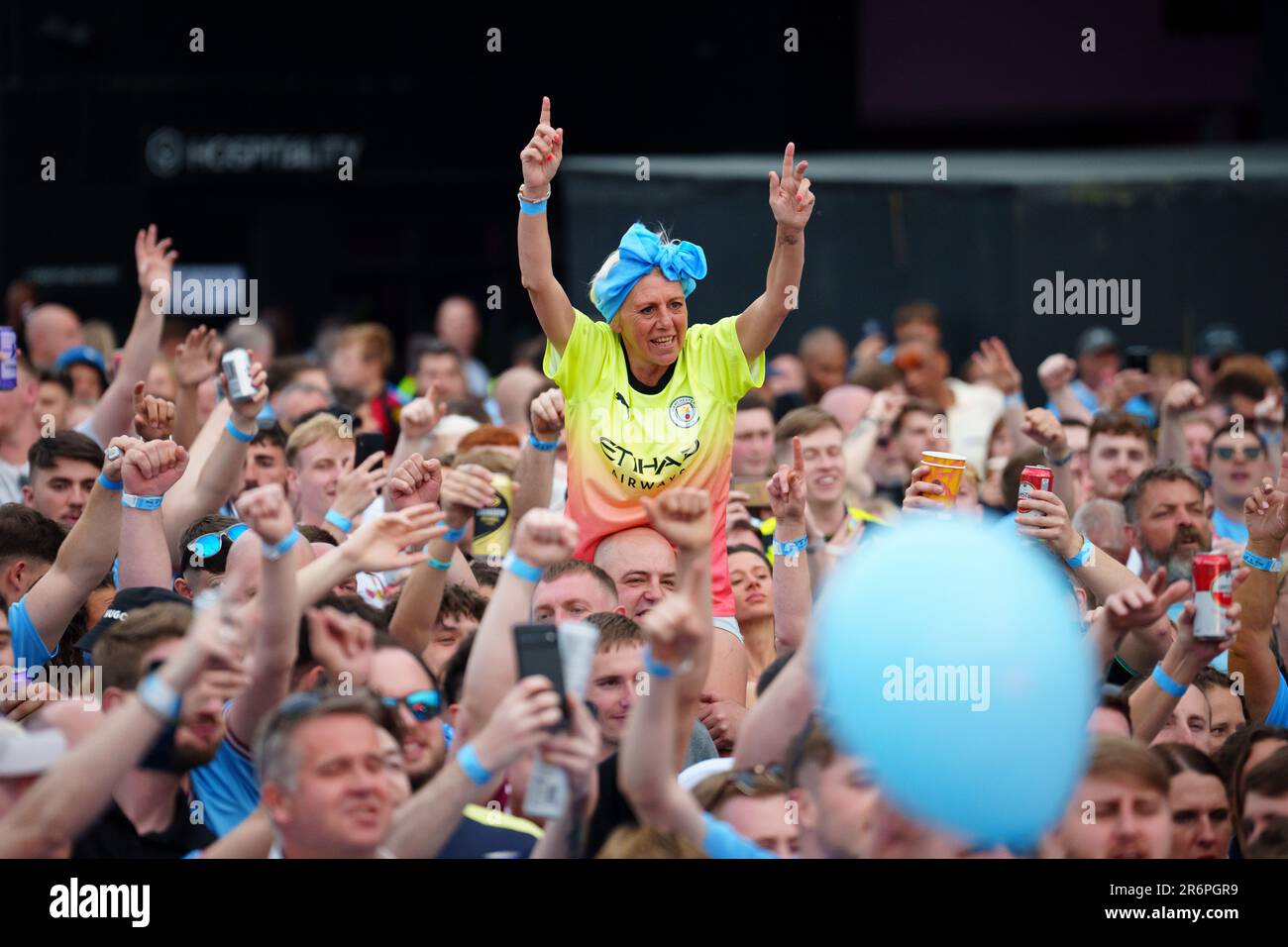 Manchester, Britain. 10th June, 2023. Manchester City supporters watch ...