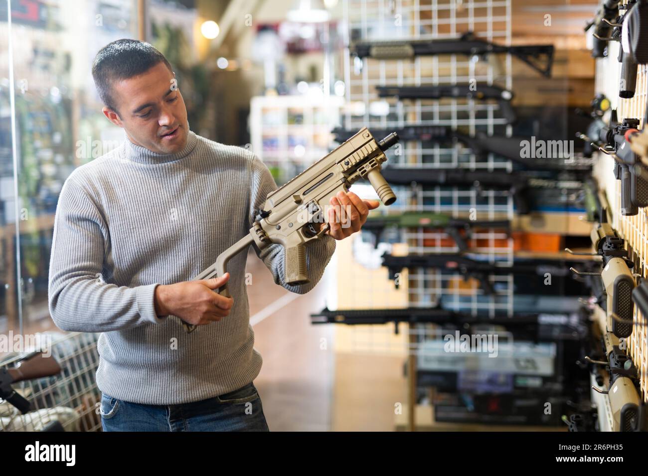 Man selecting machine gun hi-res stock photography and images - Alamy