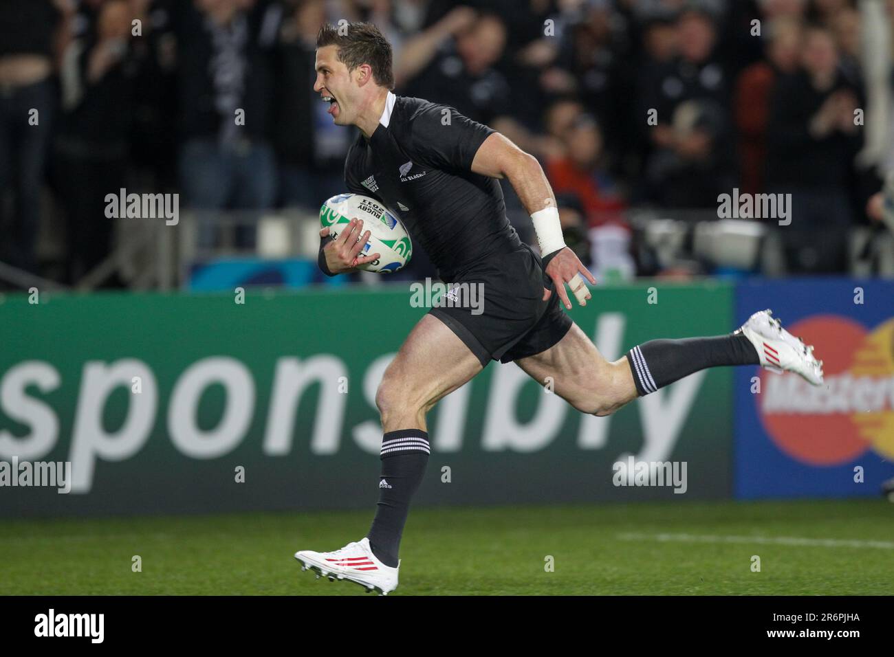 New Zealand’s Cory Jane runs home a try against France during a Pool A ...