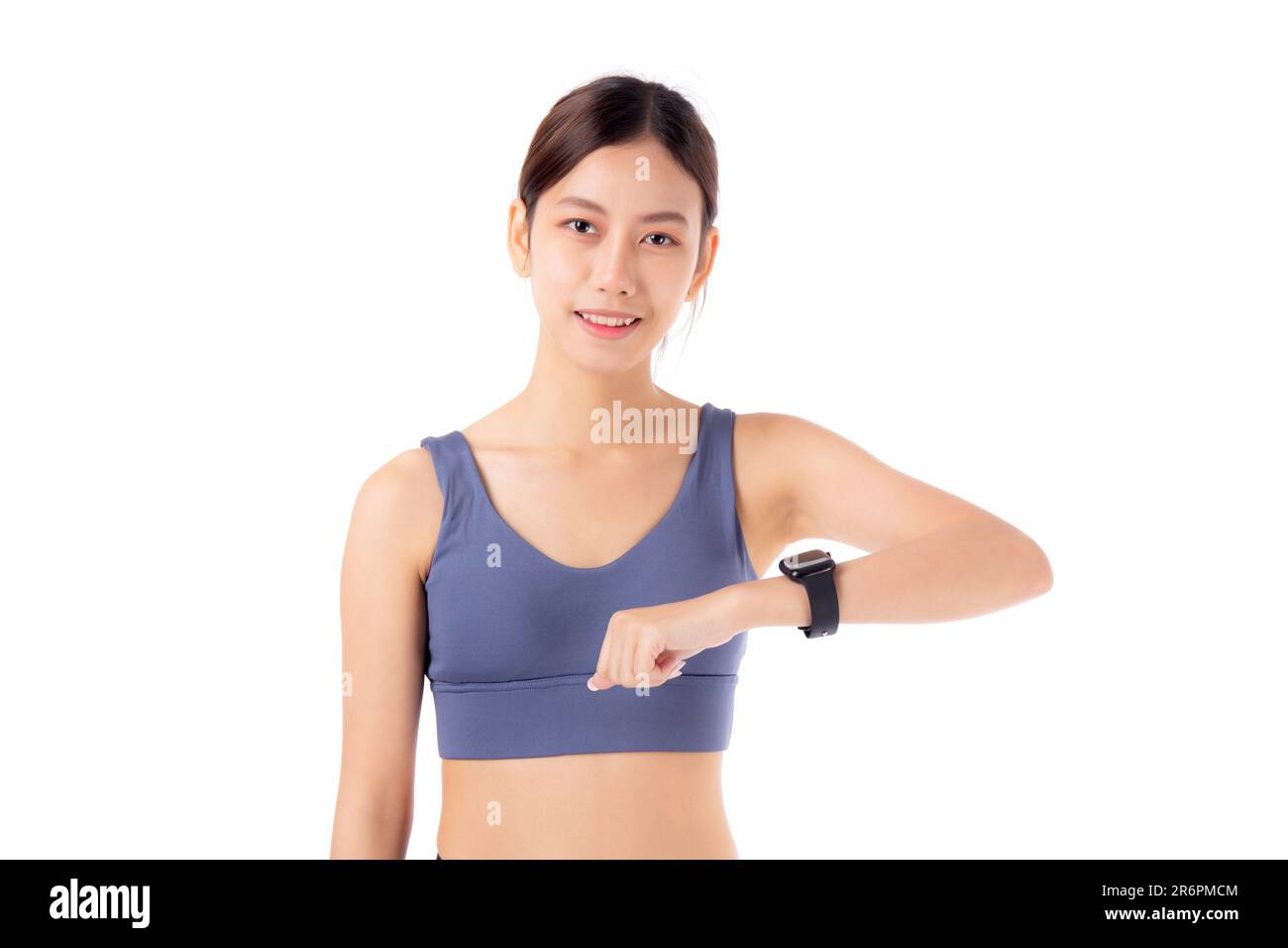 Happy young asian woman looking smartwatch for exercise and aerobics ...
