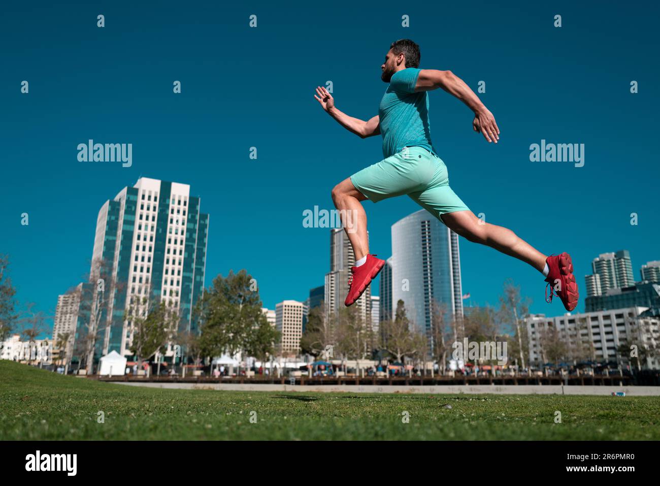 Athletic young man running in city. Dynamic jumping movement. Young and ...