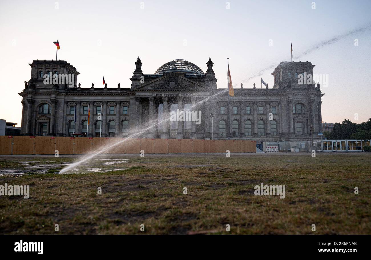 Berlin, Germany. 11th June, 2023. A water sprinkler waters the dry lawn ...