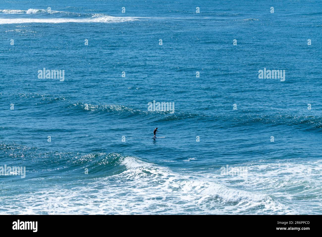 Surfer in the Pacific Ocean area off eastern Australian during autumn ...