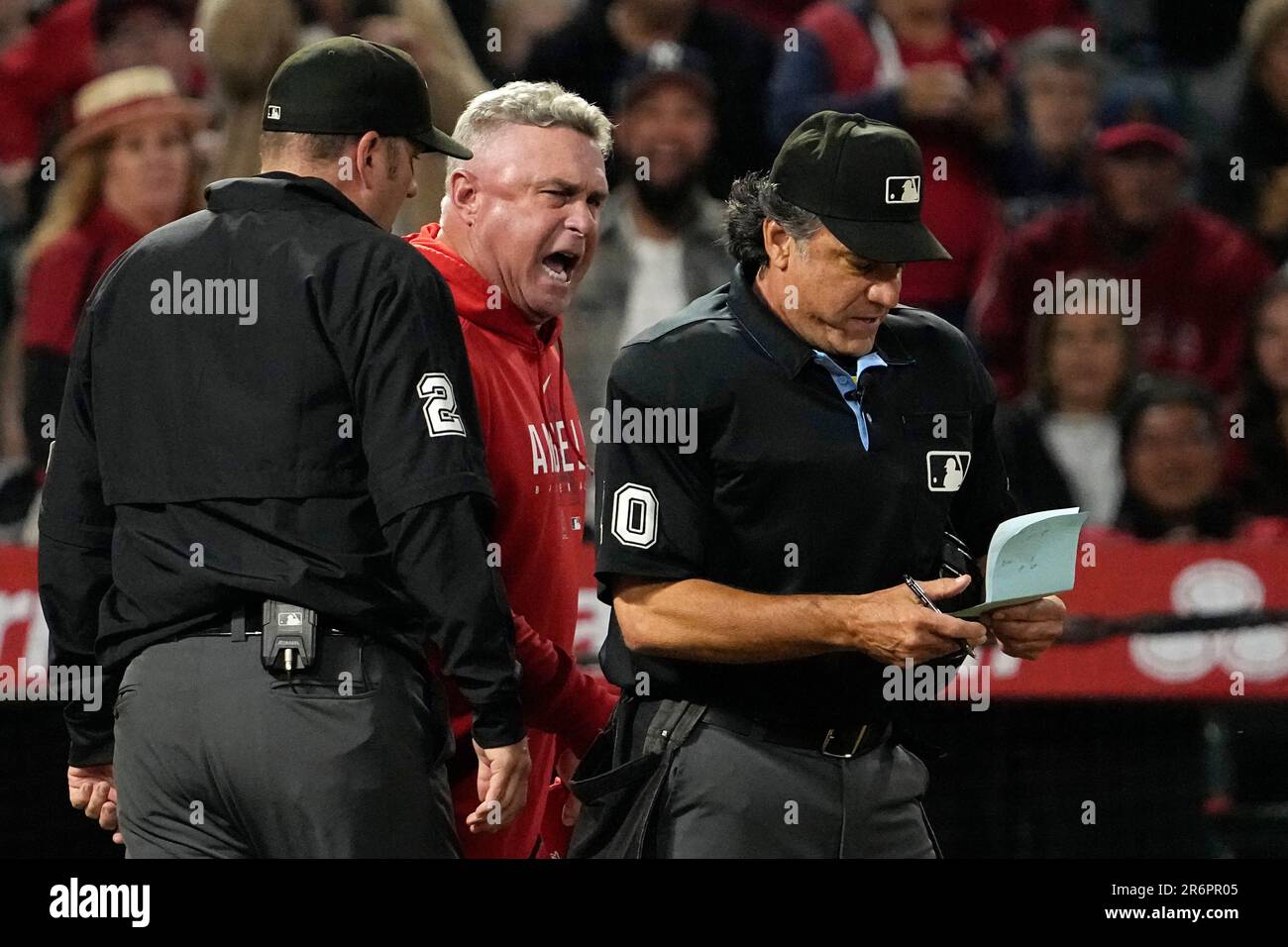 Los Angeles Angels manger Phil Nevin, center, argues with home plate ...