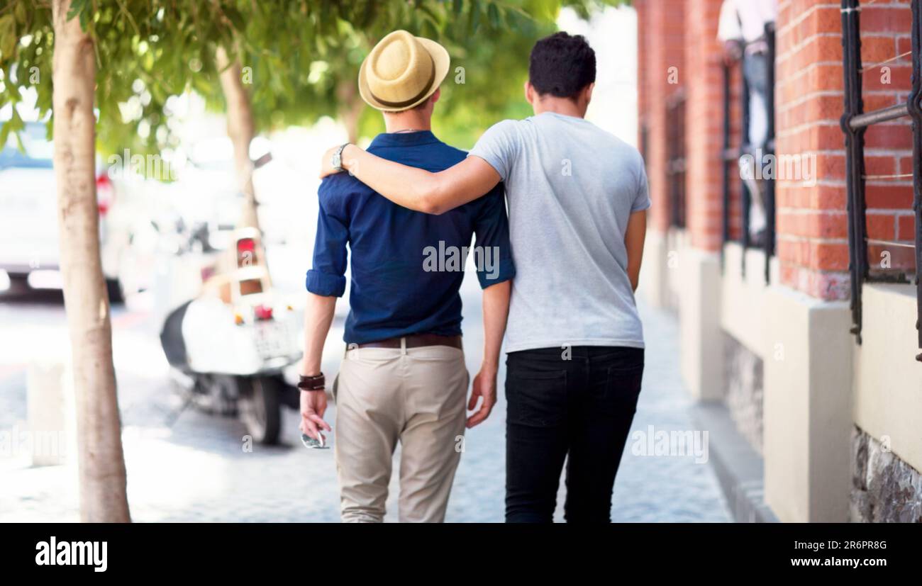 Travel, city and back of men walking in the road together while ...