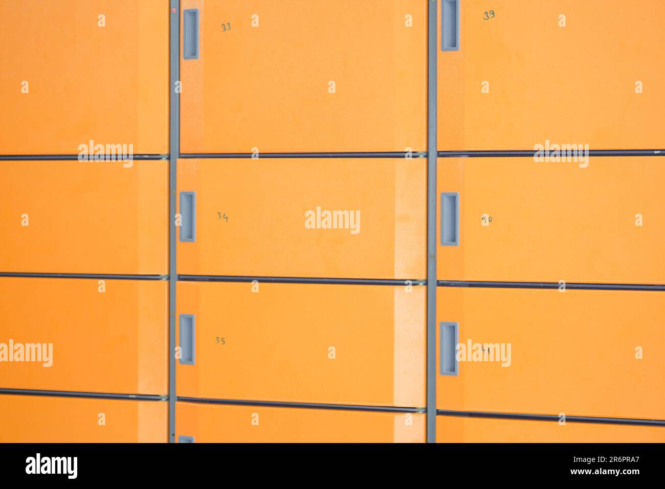 orange color storage box in public place. safe storage locker for ...