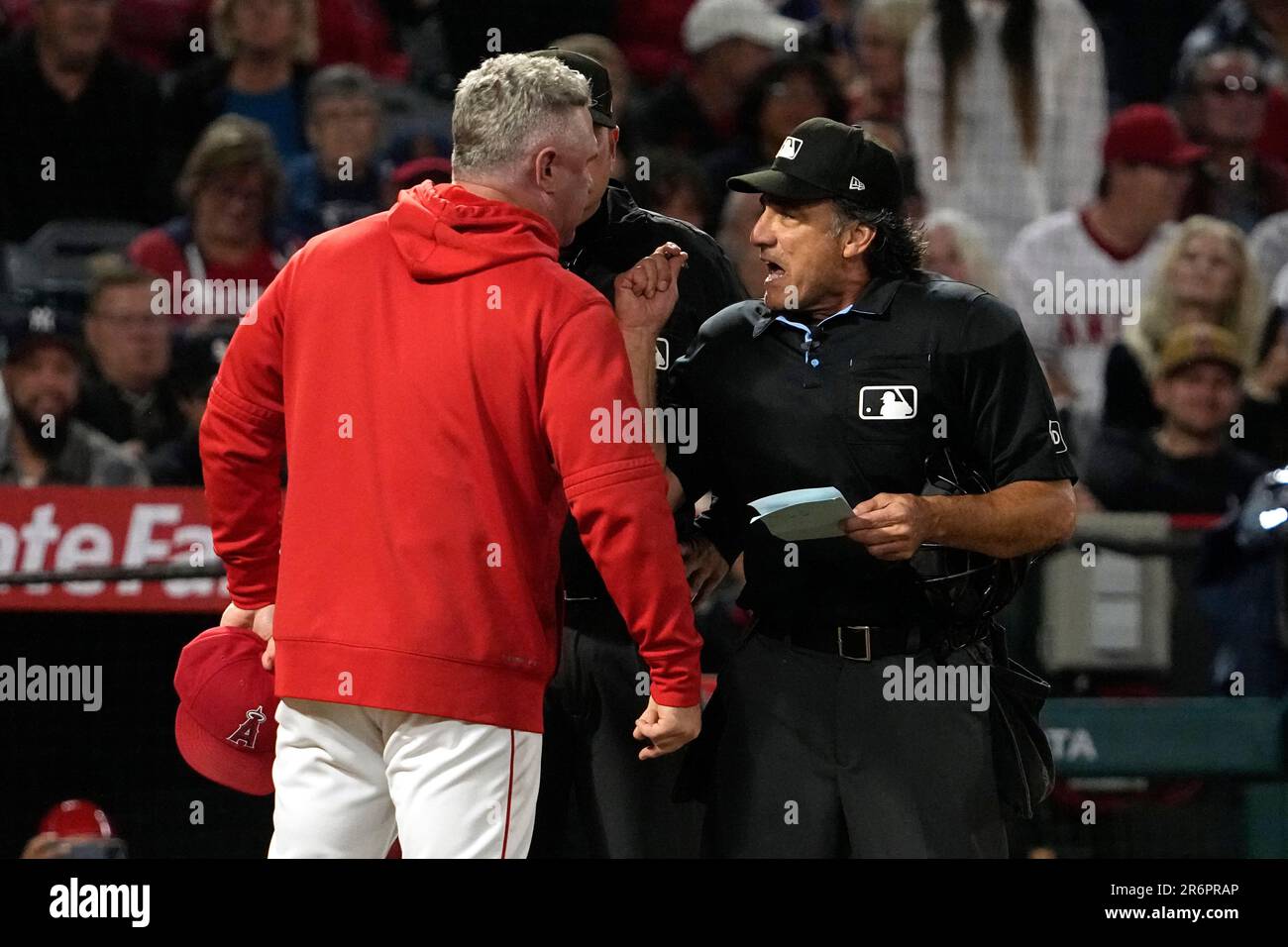 Los Angeles Angels manger Phil Nevin, left, argues with home plate ...