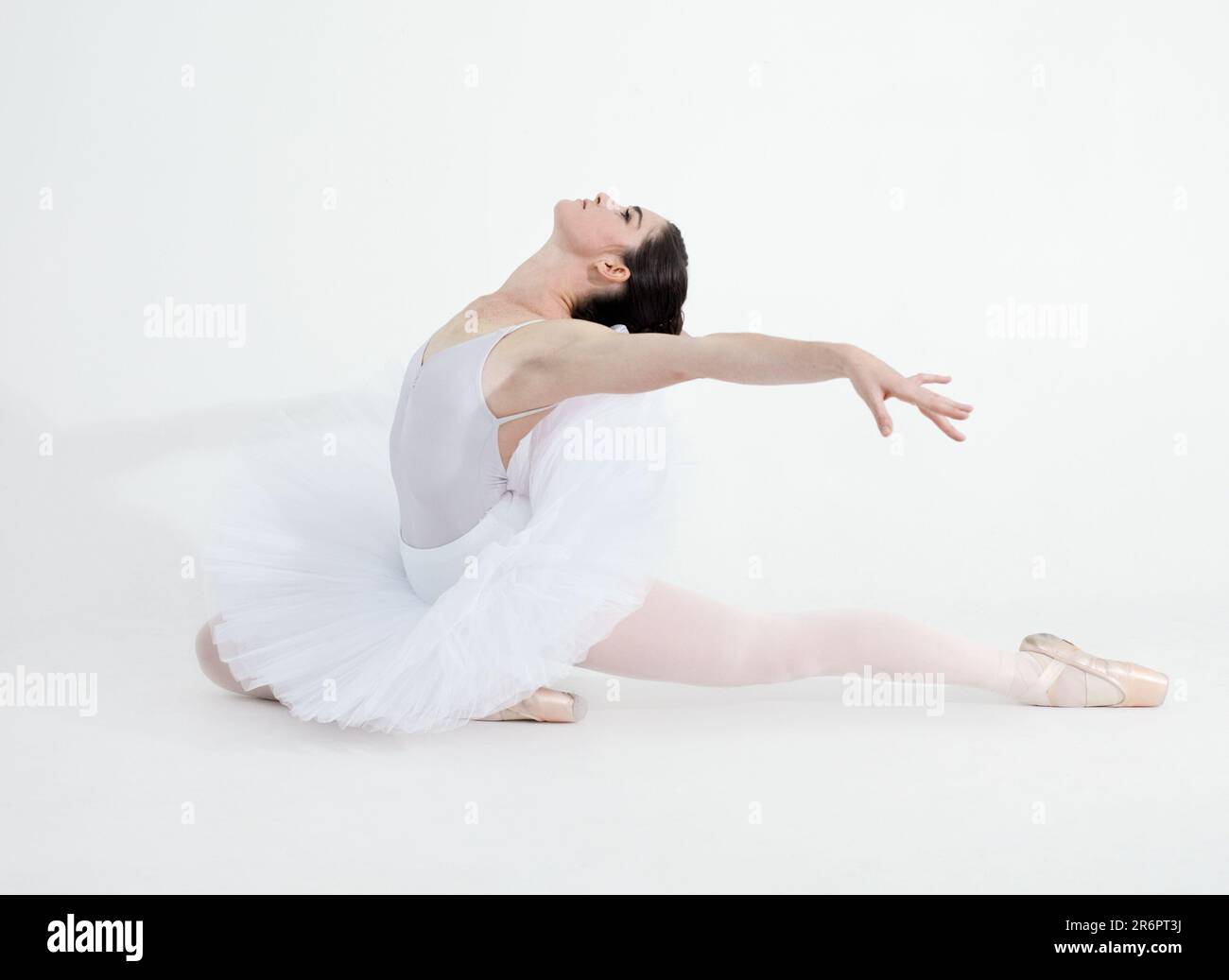 Theatre, dance and ballet with a woman in studio on a white background ...