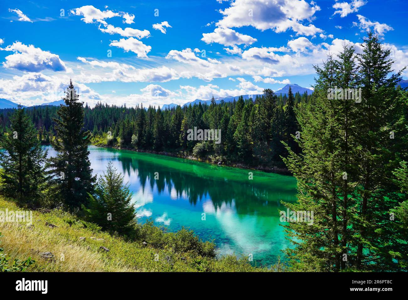 Clouds scud across a bright blue sky over the magnificient azure lakes ...