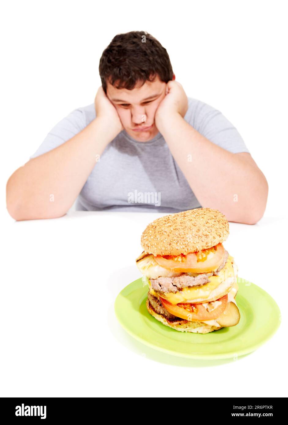 Sad, plus sized and man with a burger meal in a studio for lunch ...