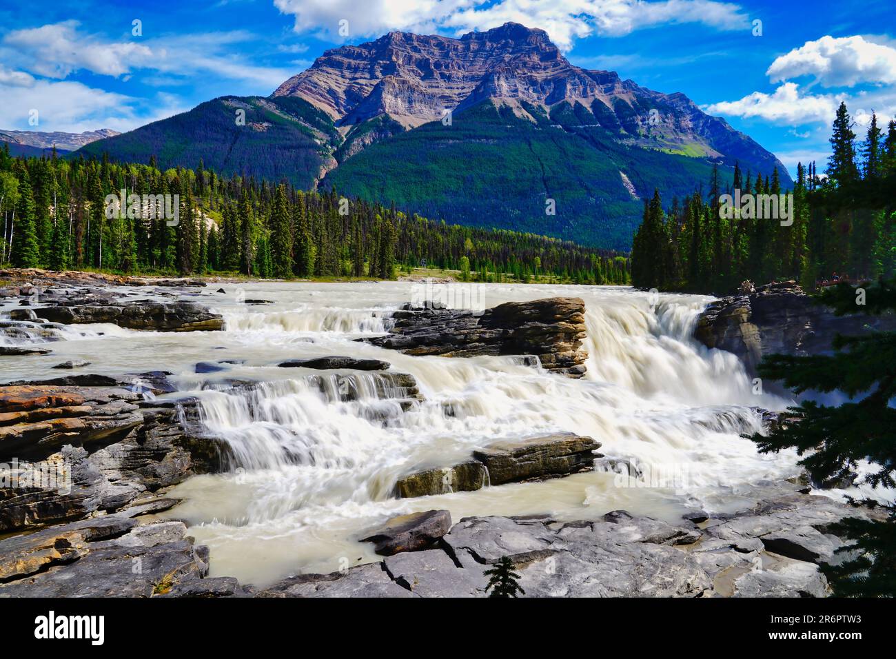 Mount Edith Cavell at 3363 meters towers above the churning waters of ...