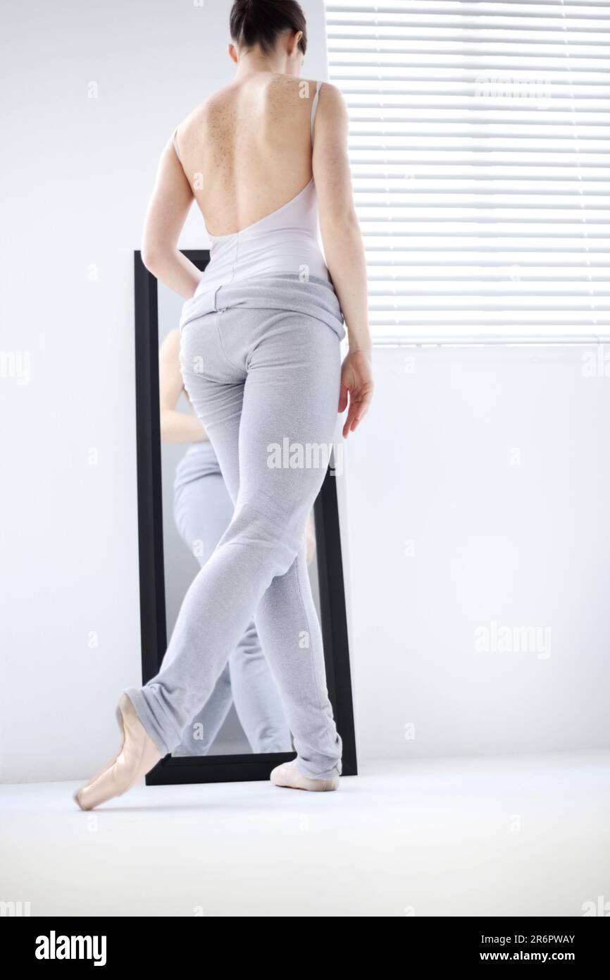 Back, ballet and woman with fitness, mirror and training for a ...