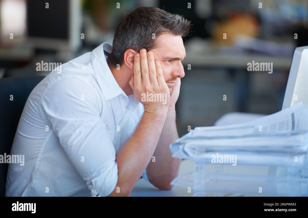 Mental health, businessman with a headache and at his desk of a modern ...
