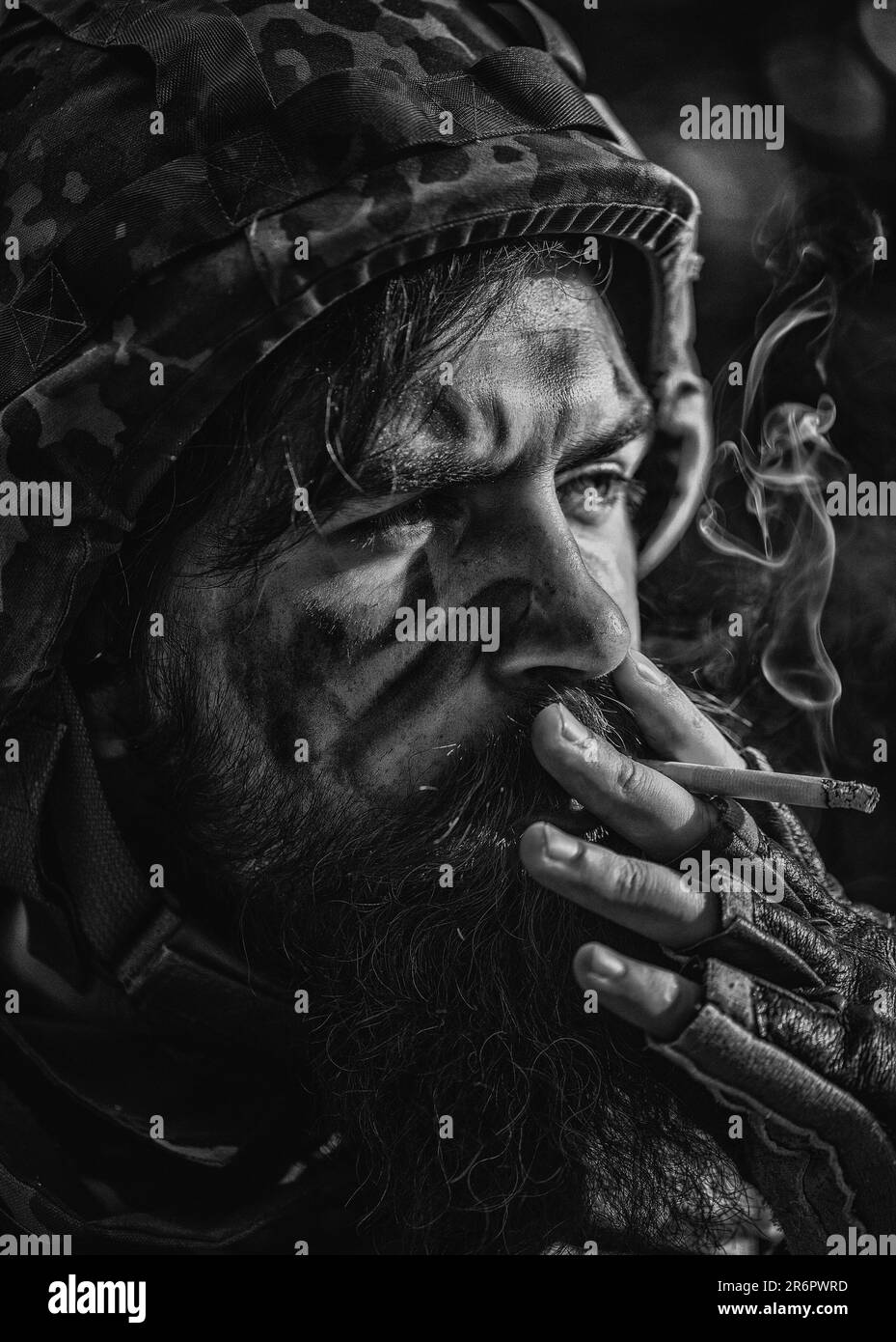 Close up portrait face of russian or ukrainian soldiers smoking. Russia ...