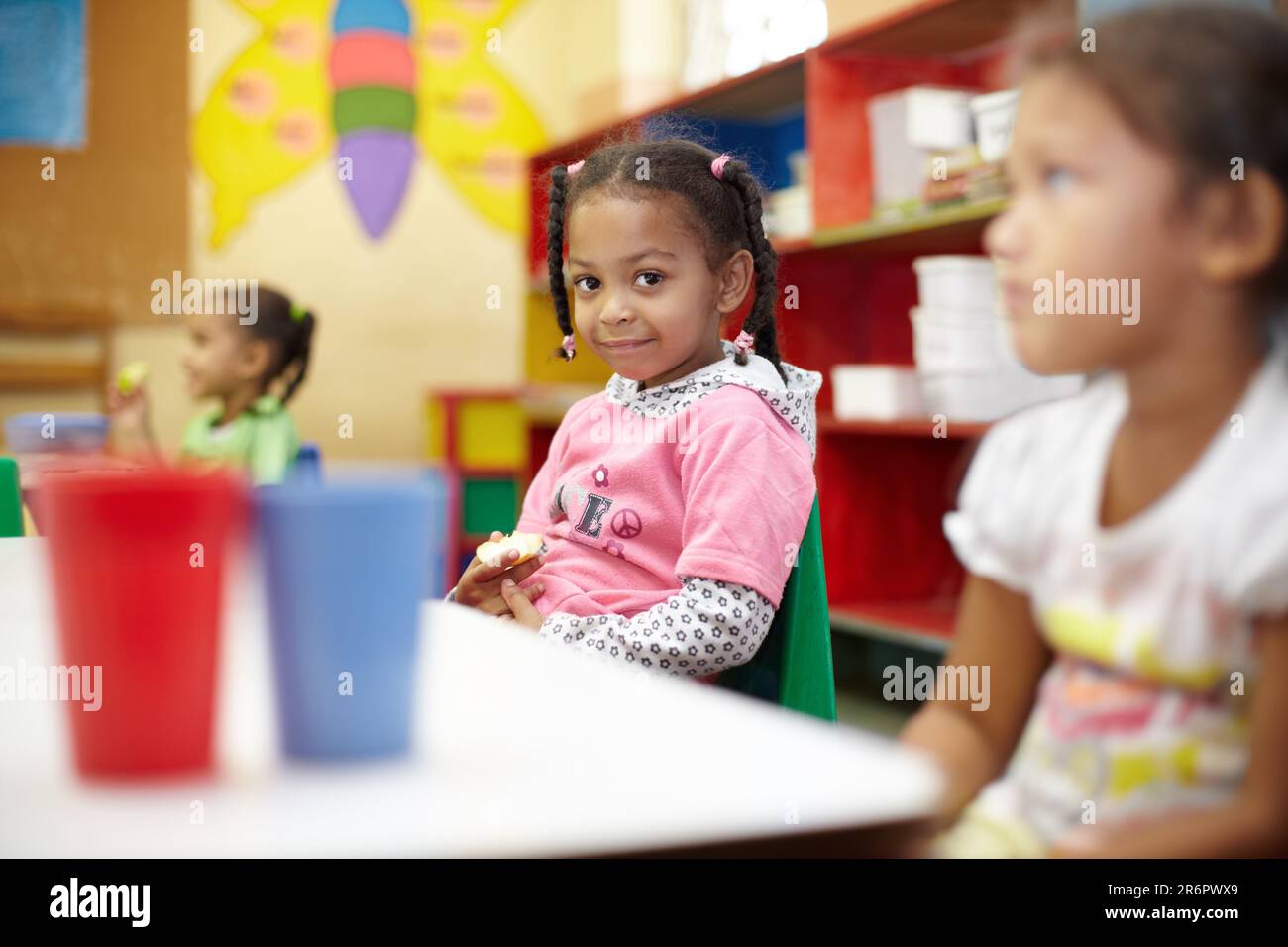 Child, classroom and lunch in portrait with smile for education at a ...