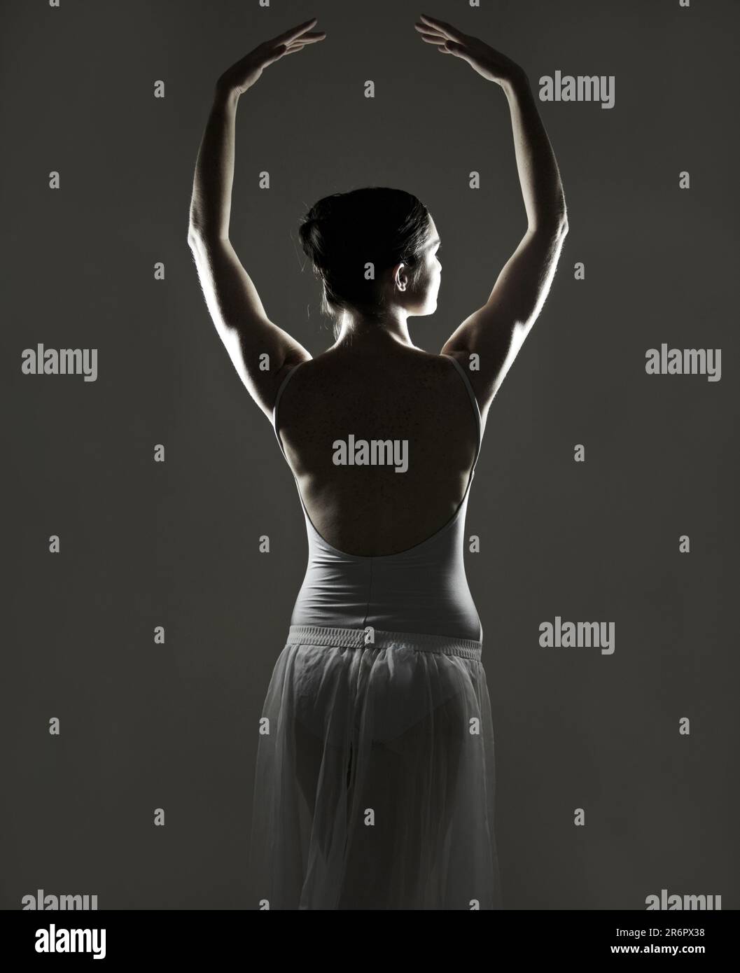 Art, silhouette and back of a ballet dancer in a studio with elegant ...