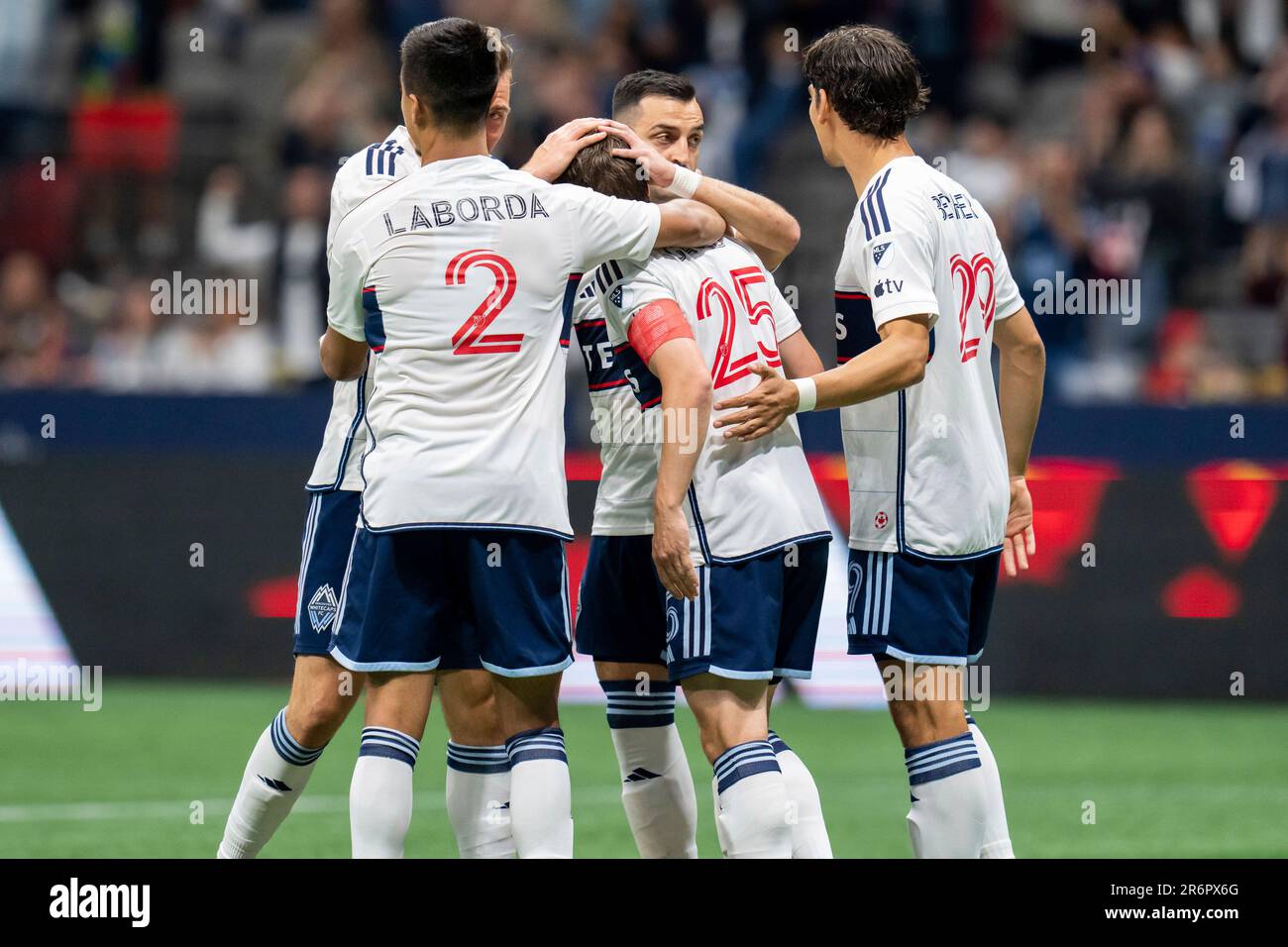Vancouver Whitecaps' Ryan Gauld (25) is congratulated by Mathias ...