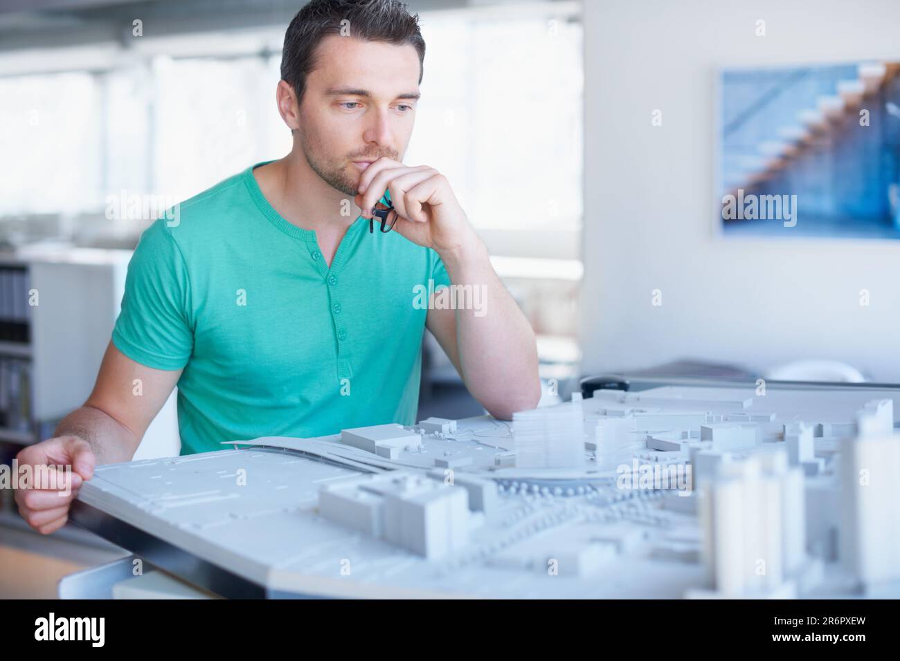 Architecture, model and business man thinking, planning and building ...