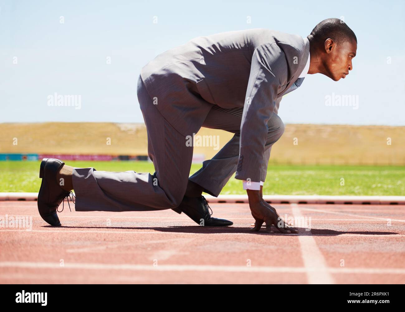 Business, start and black man with focus, race track and competition ...