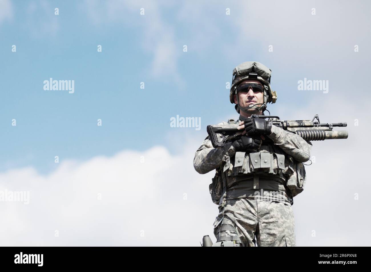Soldier man, machine gun and outdoor portrait by sky background for ...