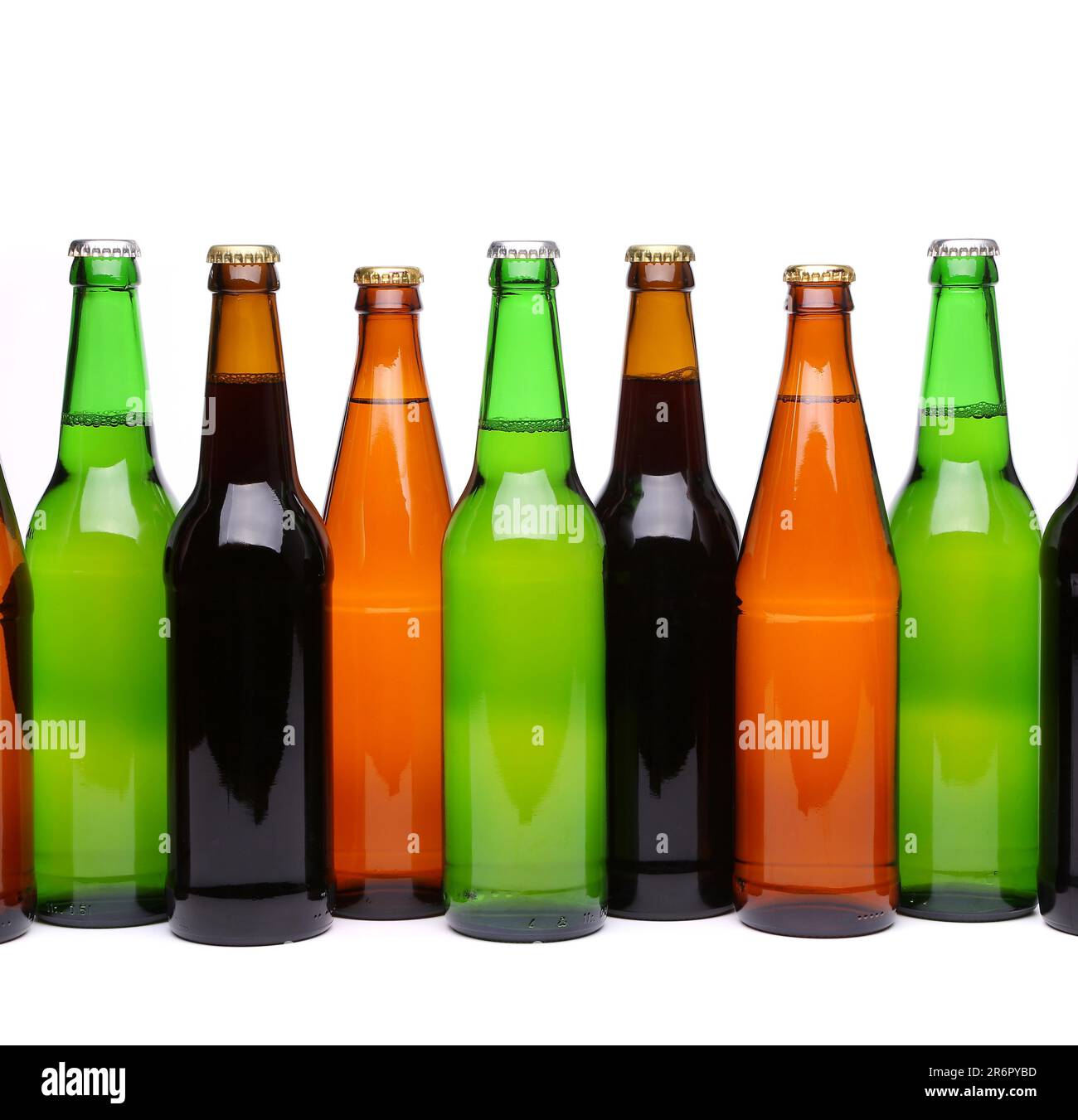 Different bottles of beer in row on the white background Stock Photo ...