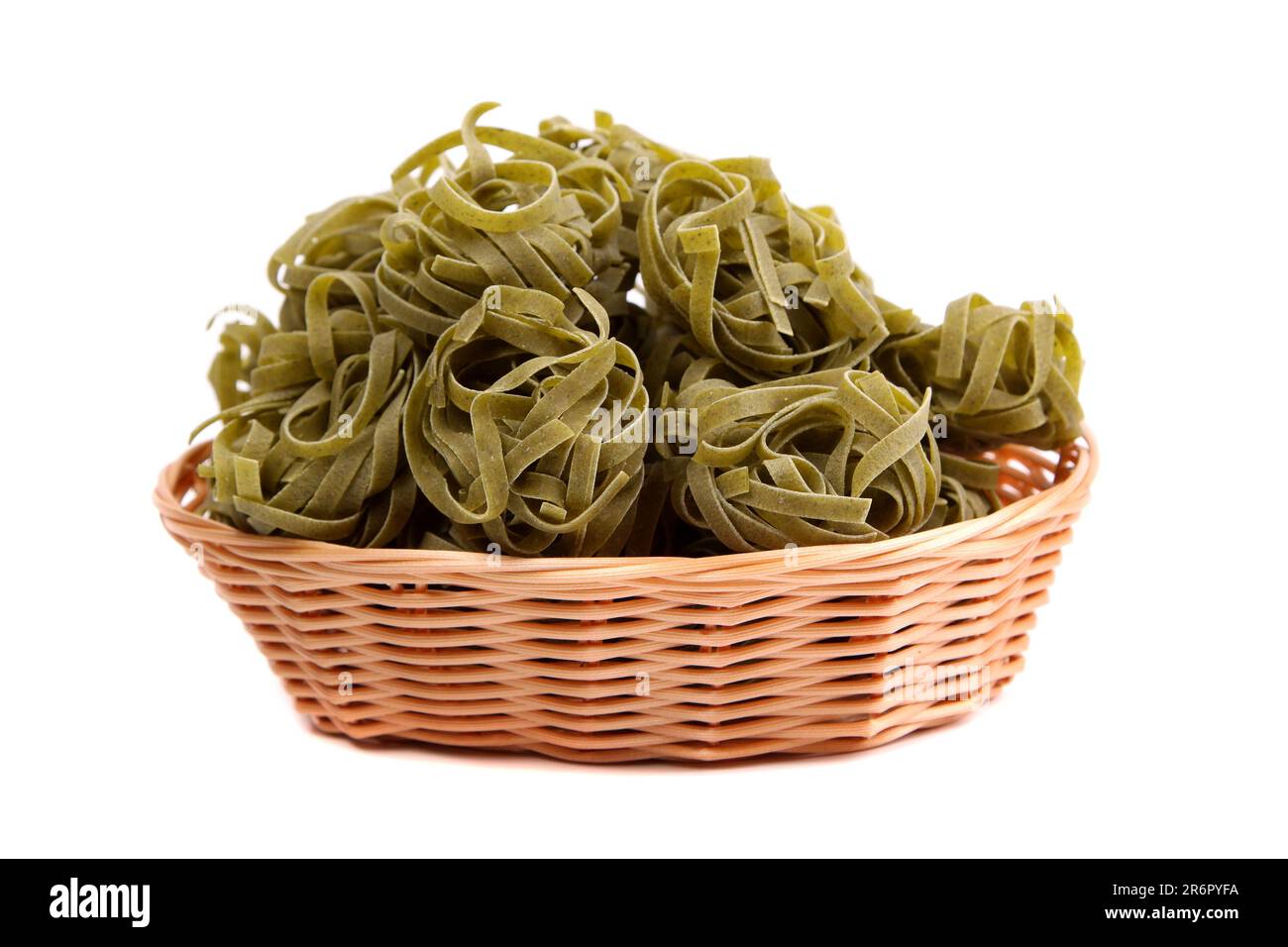 Tagliatelle paglia e fieno at round woven straw basket Stock Photo - Alamy