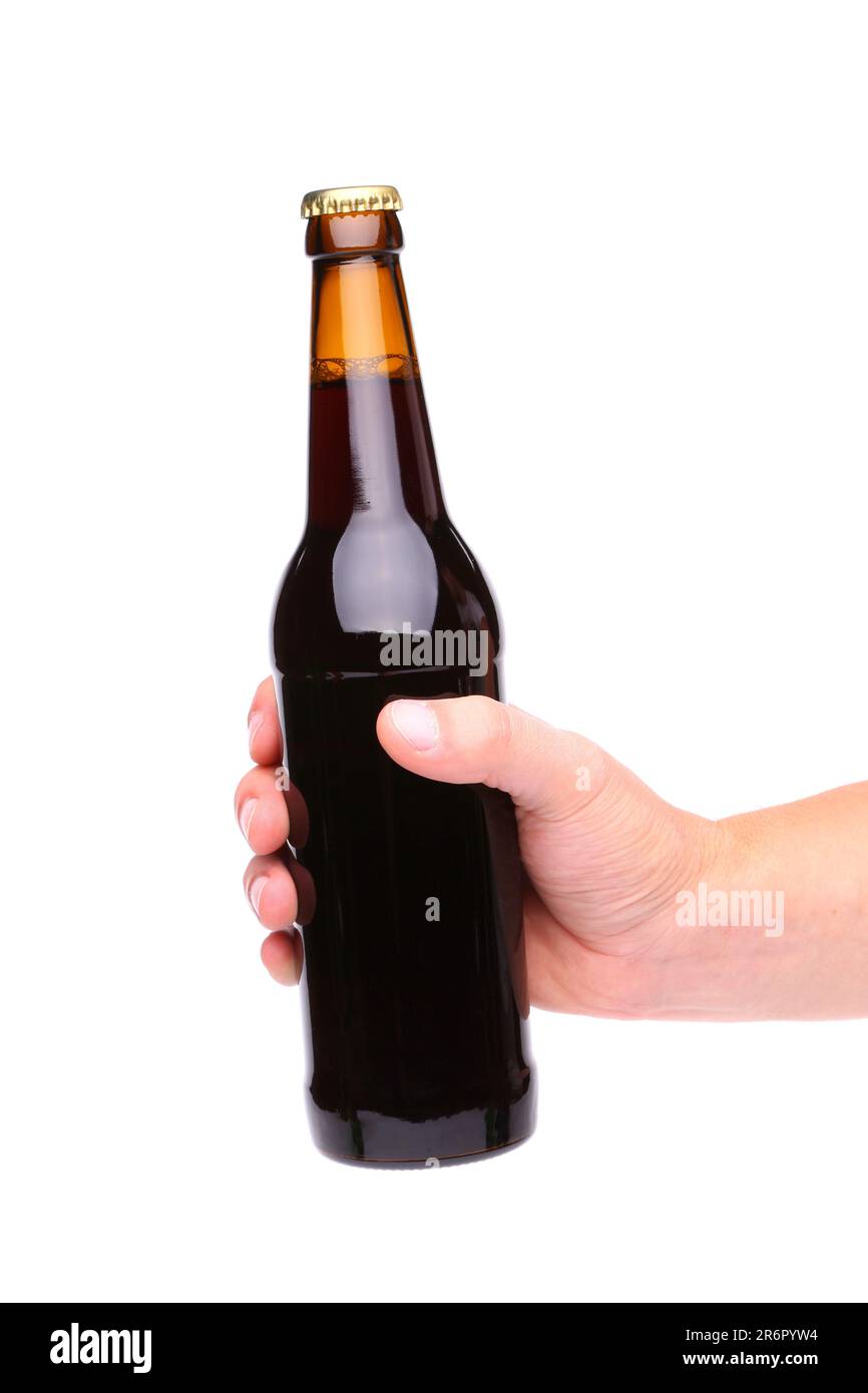 A hand holding up a brown beer bottle without label over a white ...