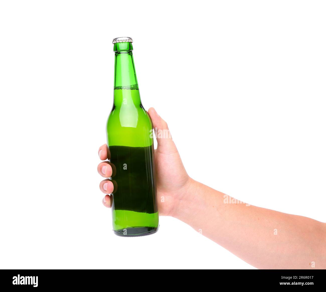 A hand holding up a green beer bottle without label over a white ...