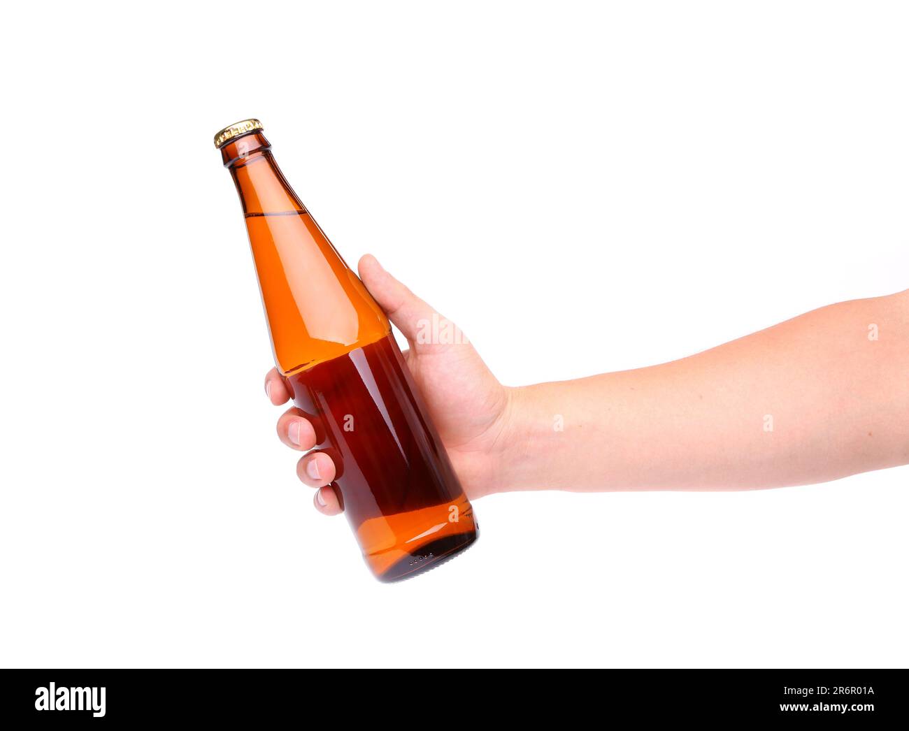 A hand holding up a yellow beer bottle without label over a white ...